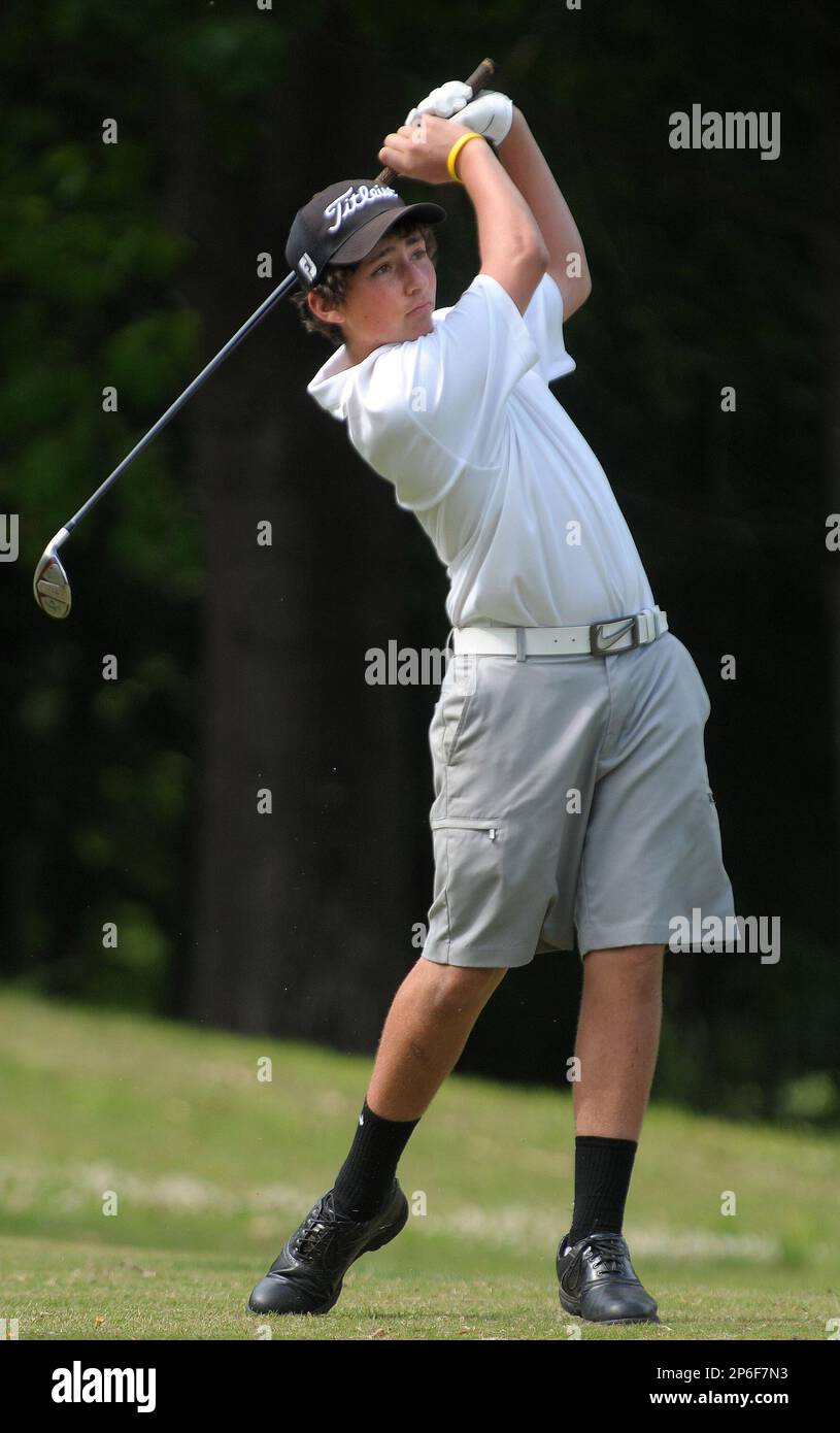 Burlington Christian Academy's Monty Corron tees off on the eighth hole ...