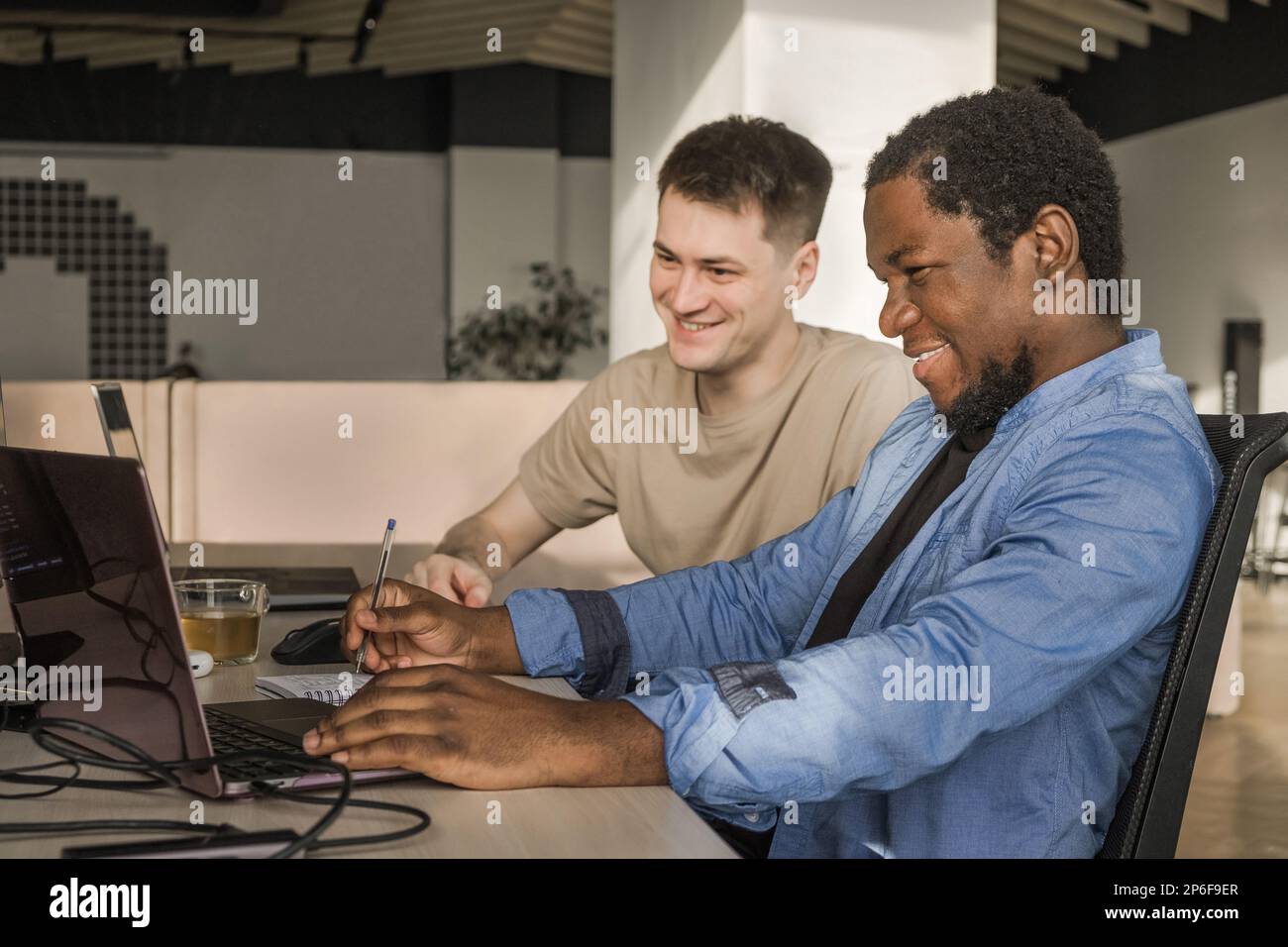 Positive web developer smiling hi-res stock photography and images - Alamy