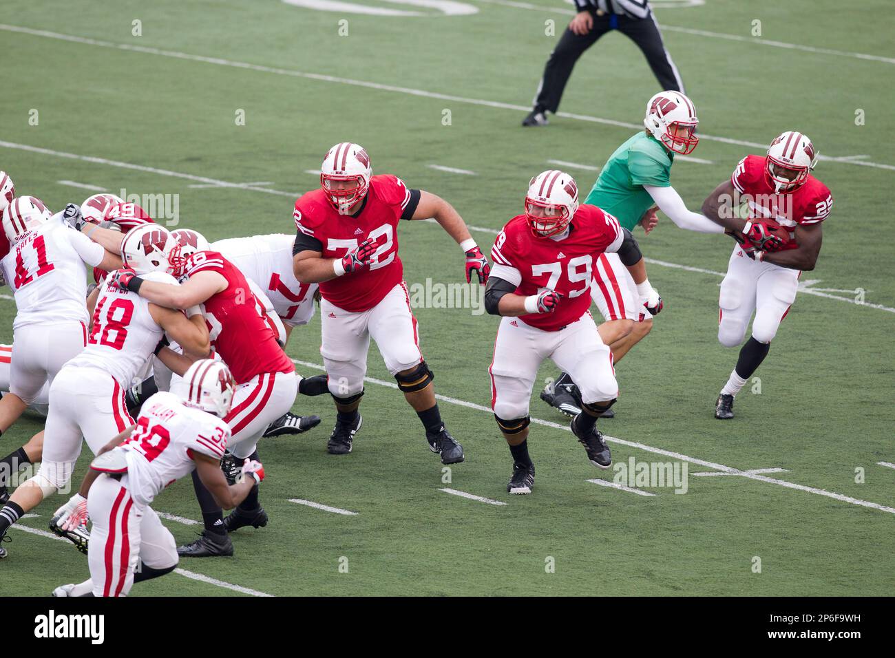 Wisconsin Badgers offensive linemen Travis Frederick (72) and Ryan Groy ...