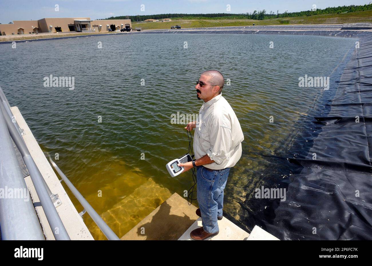 Neil Pugliese, the hatchery biologist, checks the oxygen levels in one ...