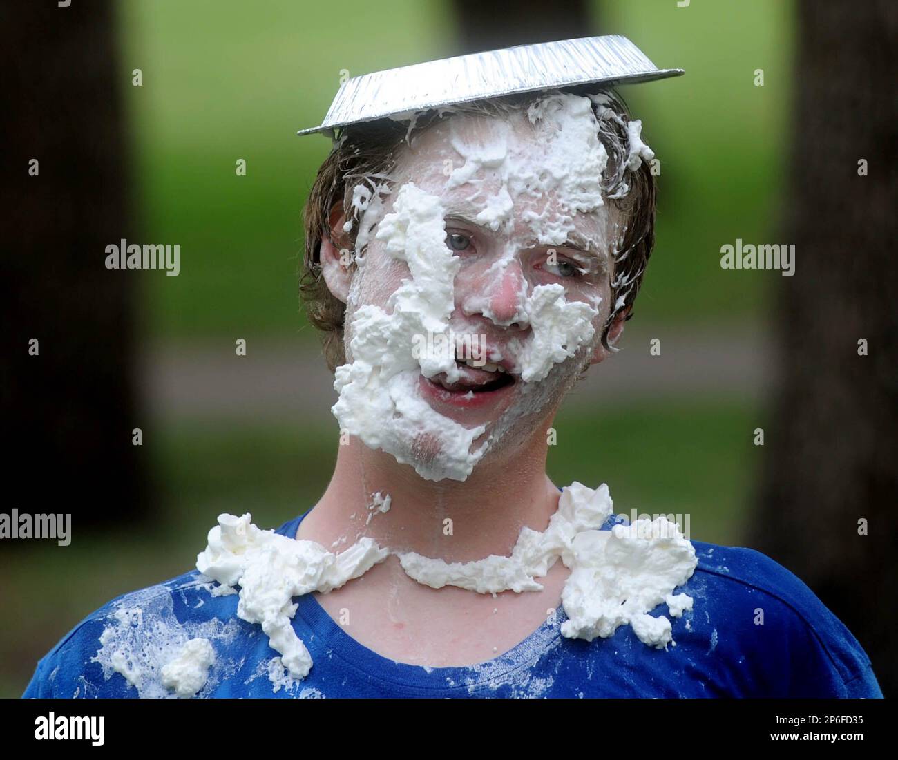 Ethan Edwards samples the whipped cream after he got a pie in the face ...