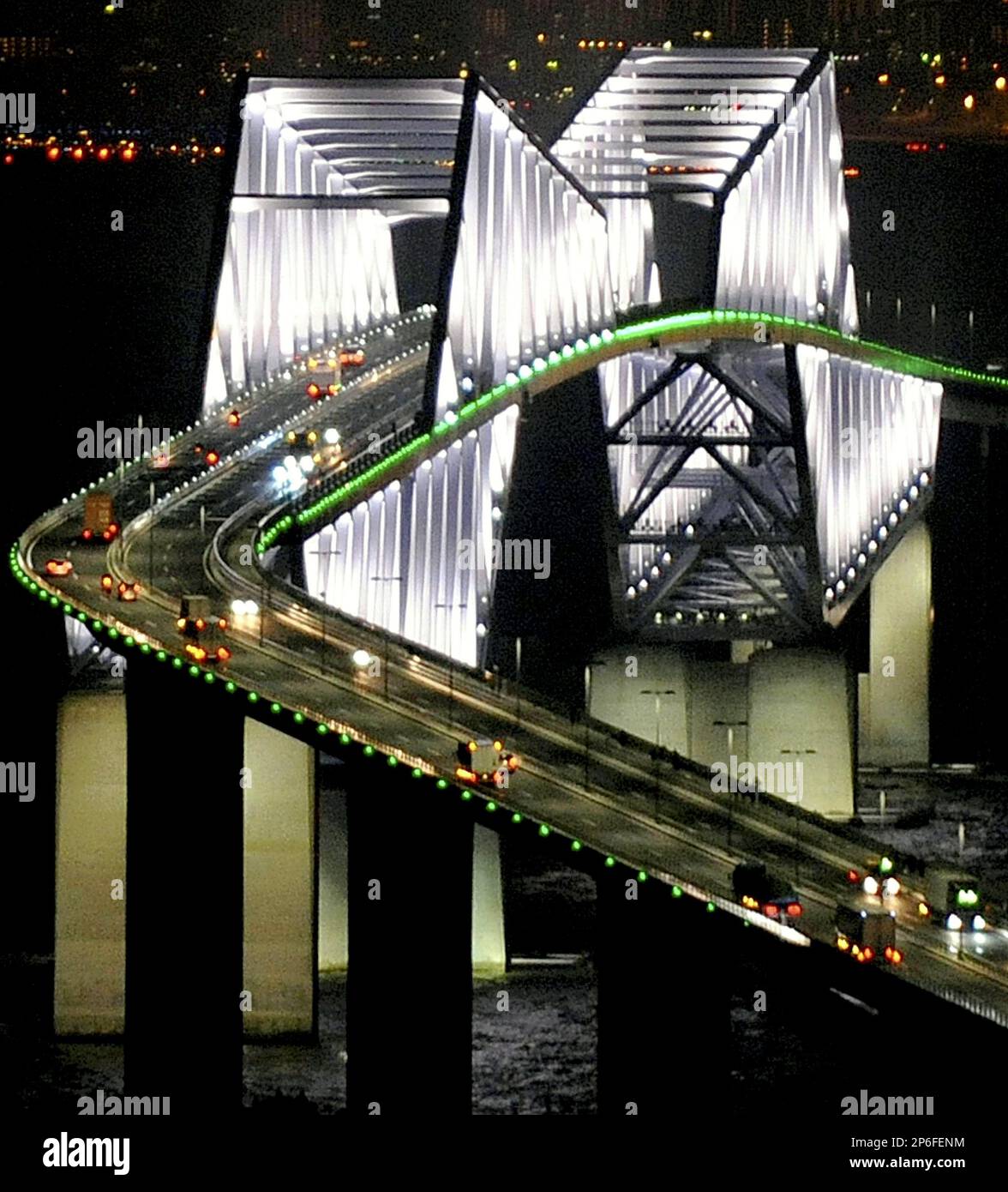 A photo shows Tokyo Gate Bridge illuminated in Tokyo Bay on April 25 ...