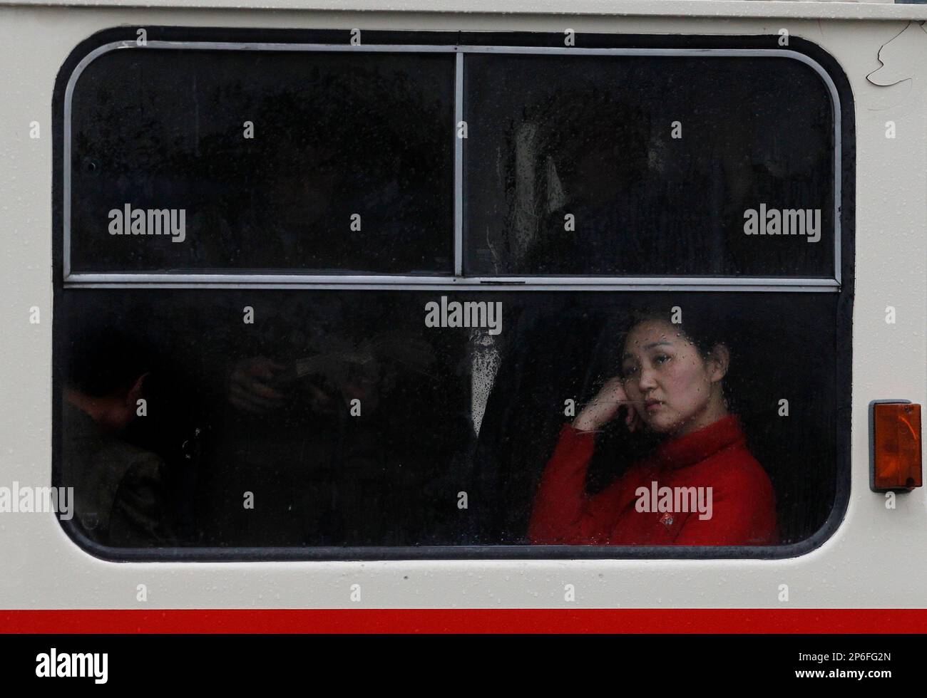 A North Korean woman rides on a tram on a rainy day in Pyongyang, North ...
