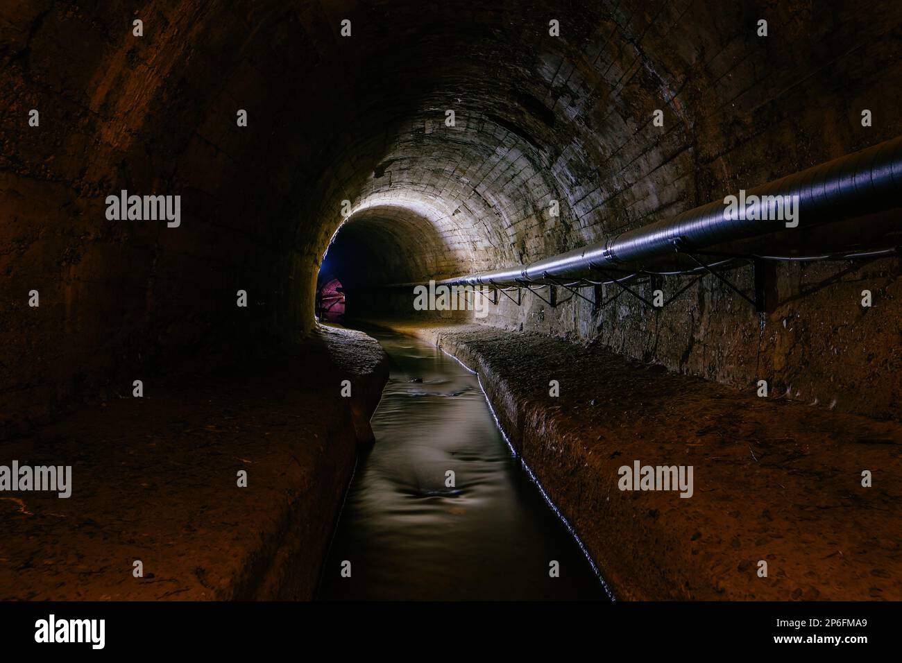 Underground vaulted urban sewer tunnel with dirty sewage Stock Photo ...
