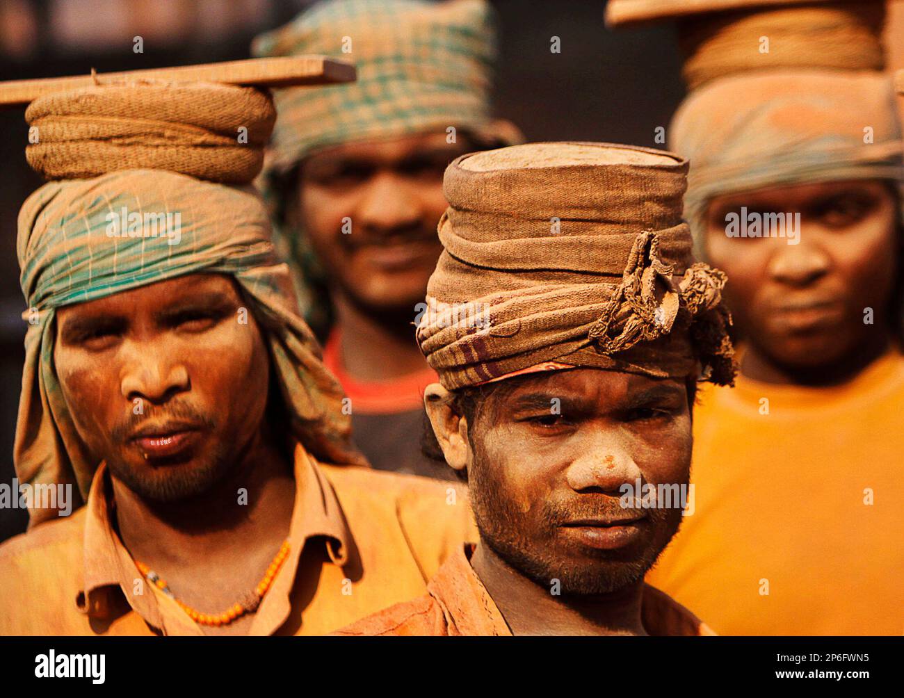 Nepalese workers stand together at a brick factory in Imadol on the ...
