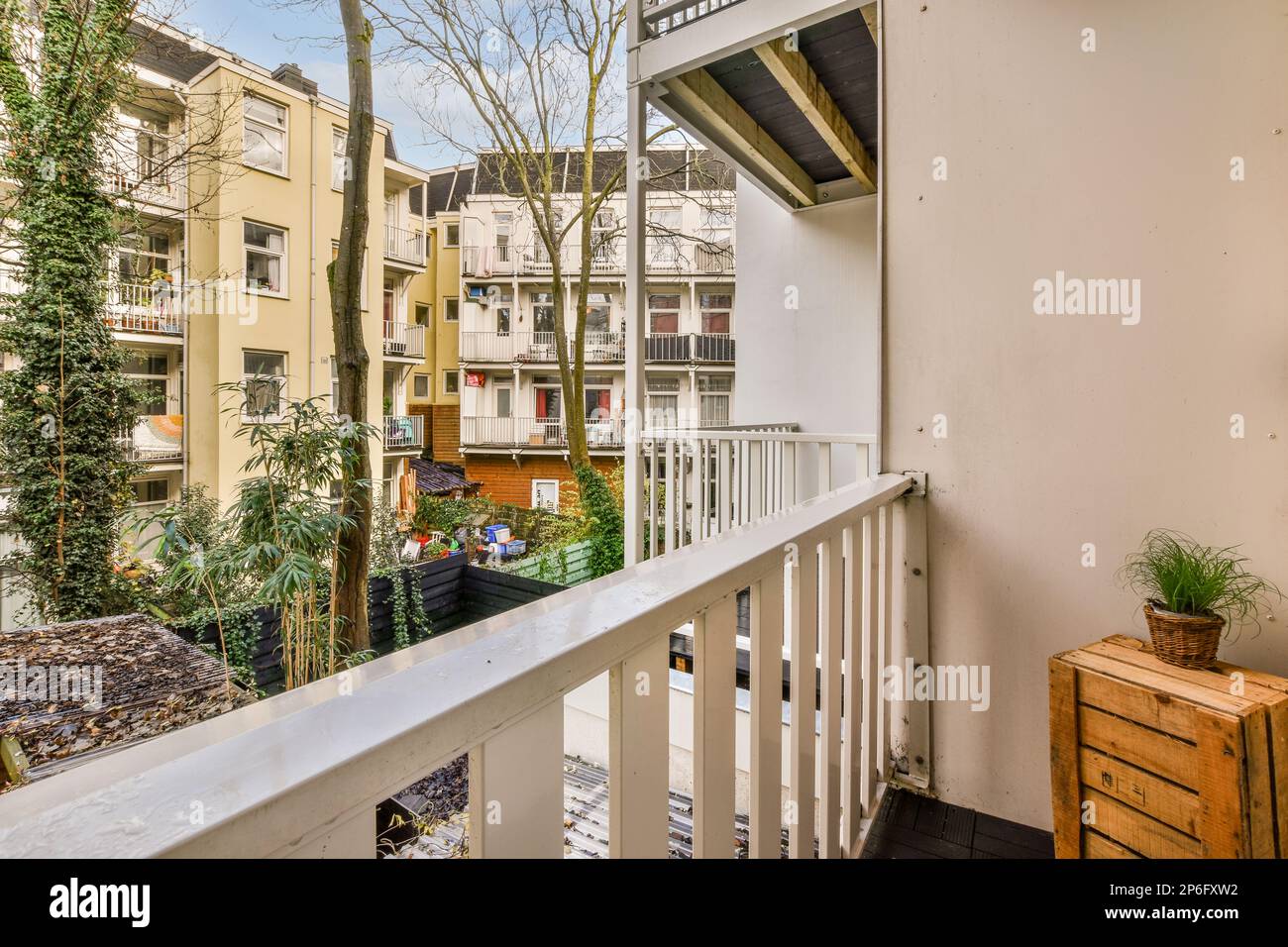 an outside area with trees and buildings in the background, taken from ...