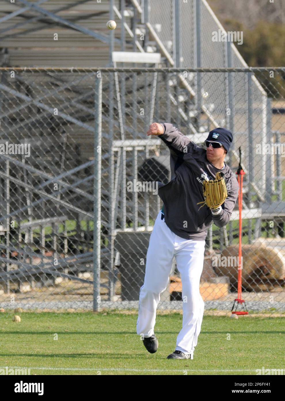 UNCW pitcher Tyler Molinaro warms up during practice following media ...
