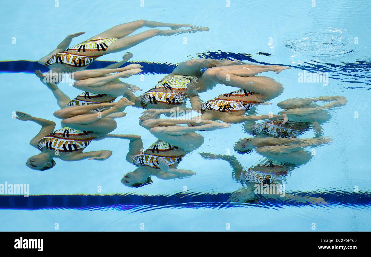 Competitors from the U.S. perform during the team's technical routine ...