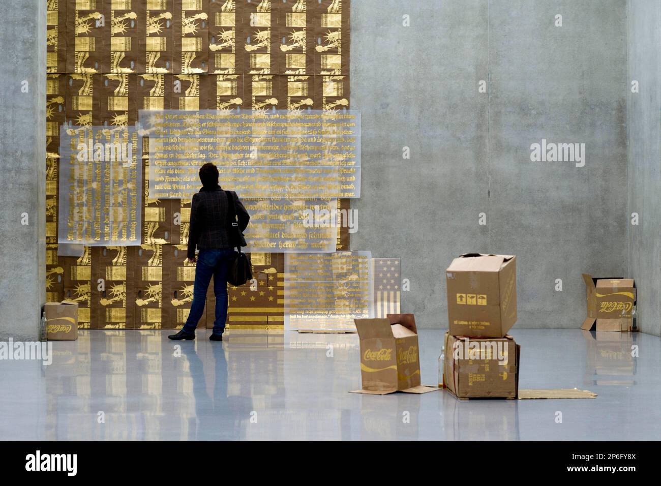 A woman watches an installation by Vietnamese artist Danh Vo during the ...