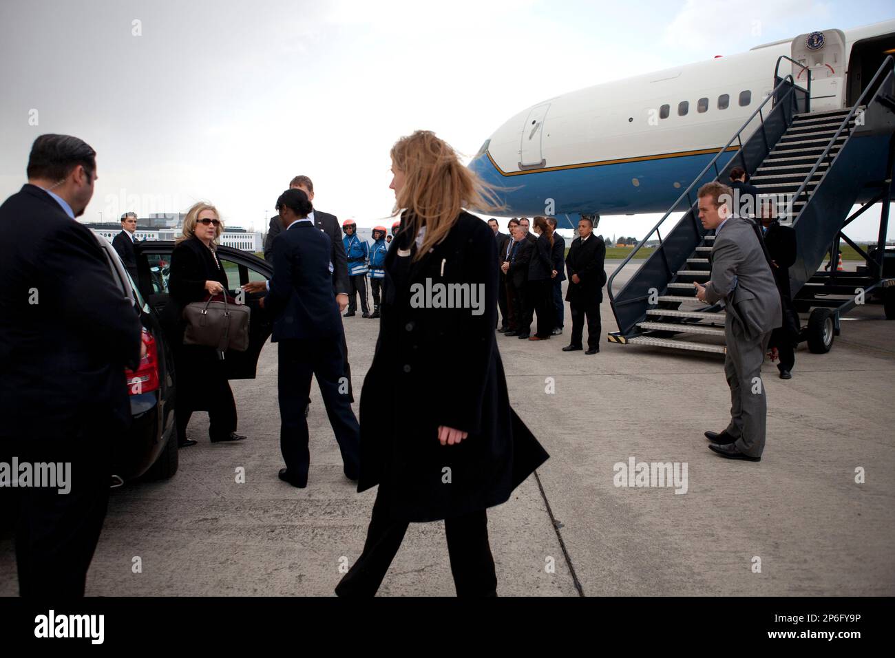 Secretary of State Hillary Rodham Clinton arrives to board her plane ...