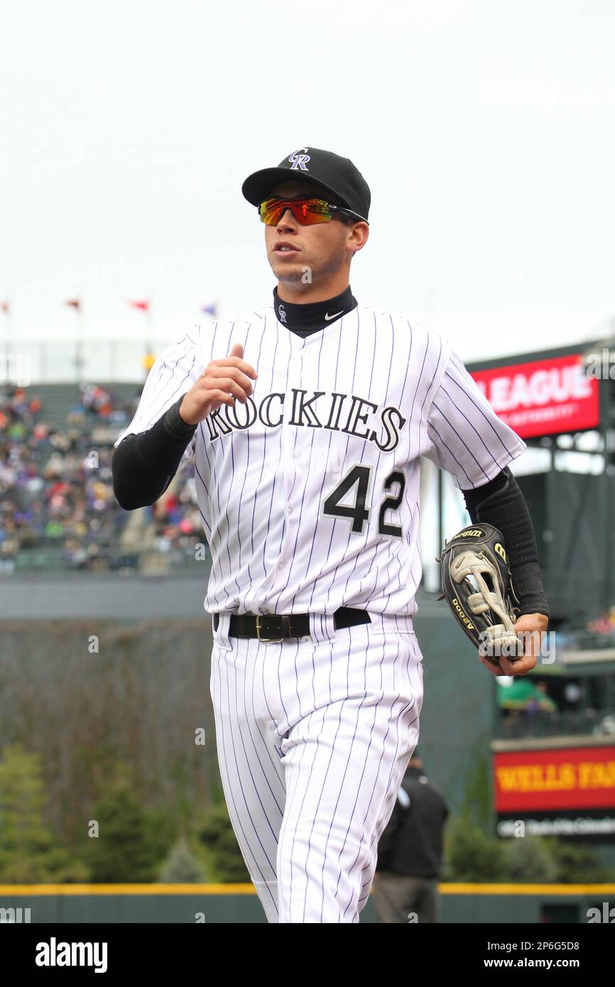 Colorado Rockies left fielder Tyler Colvin (21) heads to the dugout in ...