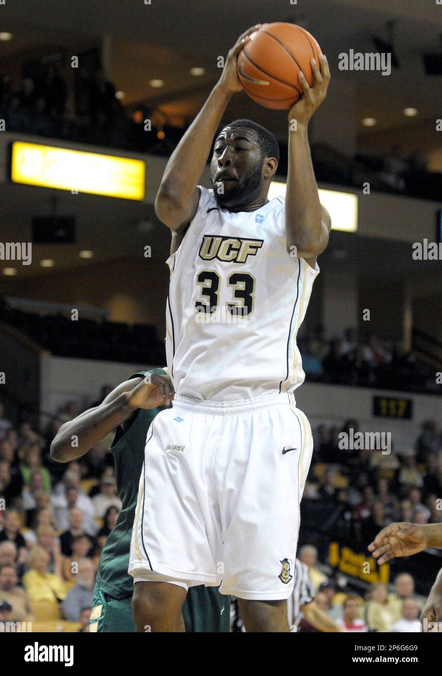 Central Florida forward Keith Clanton grabs a rebound during the first ...