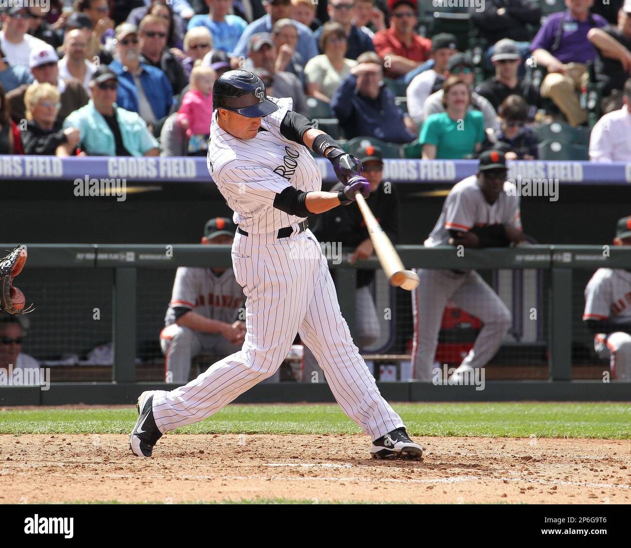 Colorado Rockies catcher Jordan Pacheco (22) connects with the ball in ...
