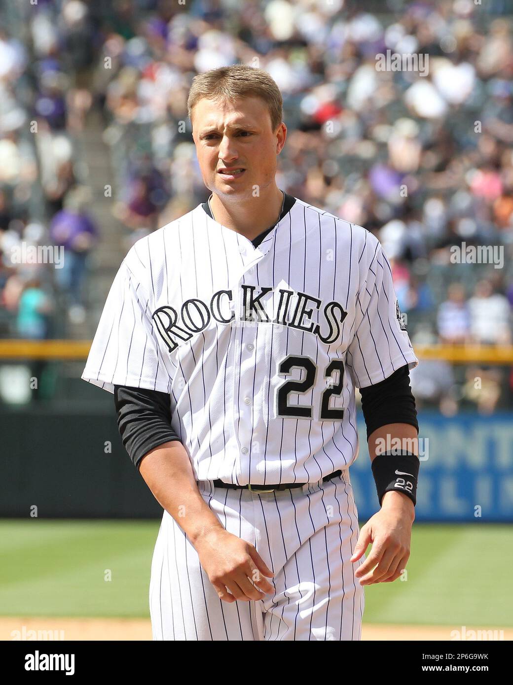 Colorado Rockies catcher Jordan Pacheco (22) waits for his hat and ...
