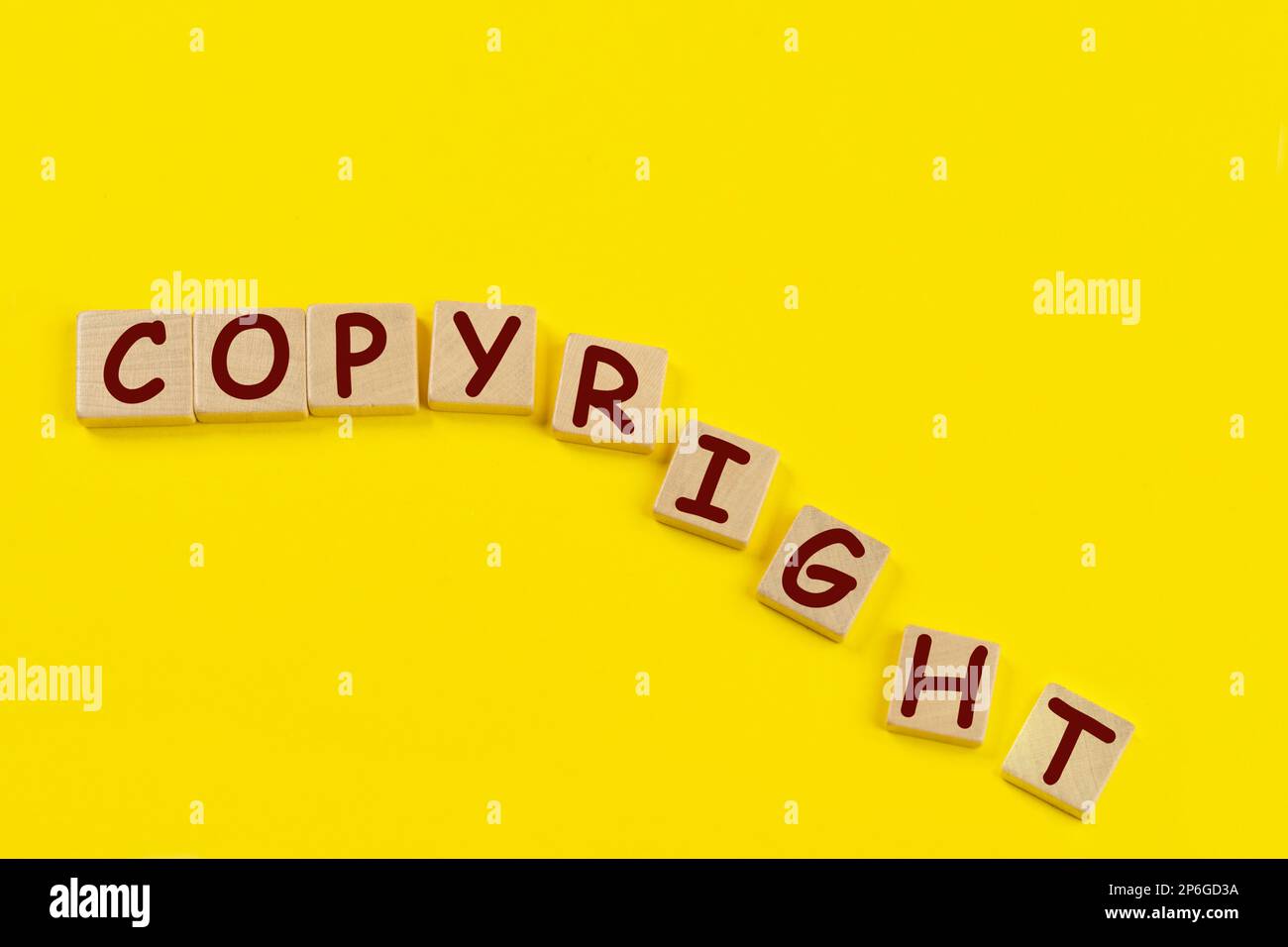 the word Copyright formed with small wooden tablets on a colored ...