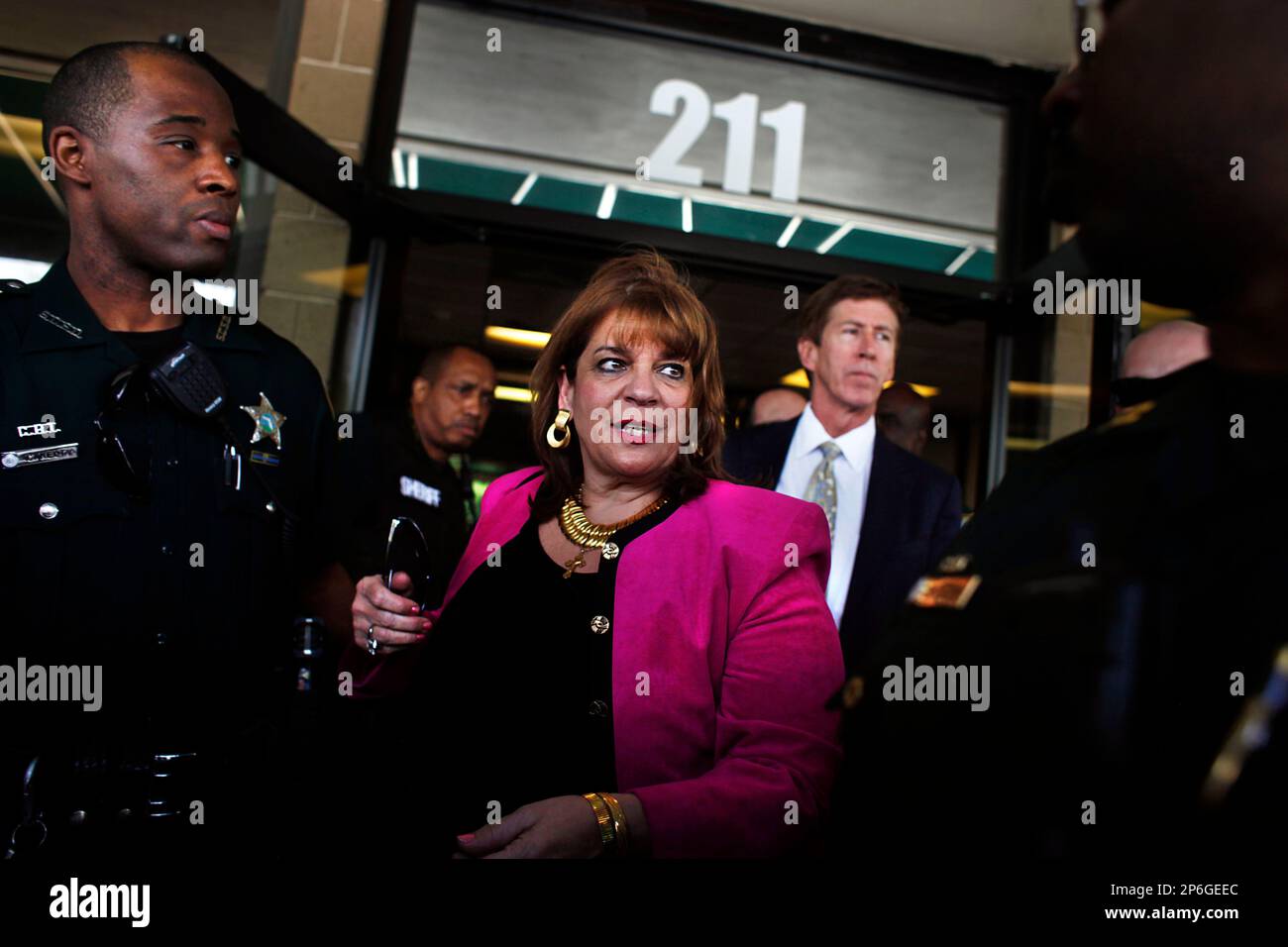 State Attorney Angela Corey, front and defense attorney Mark O'Mara ...