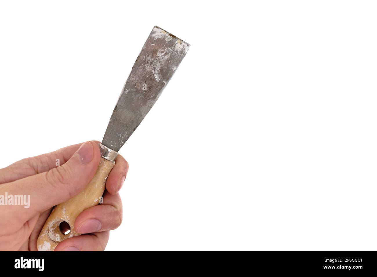 Holding steel painting spatula in a hand on white background, being ...