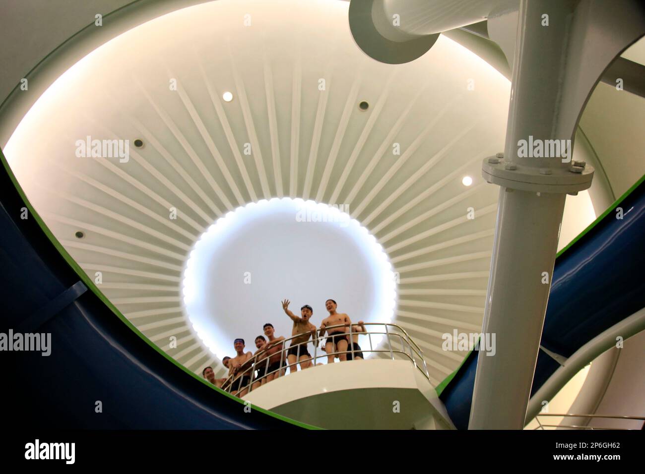 North Korean youths react at the water slide of a pool facility at the ...