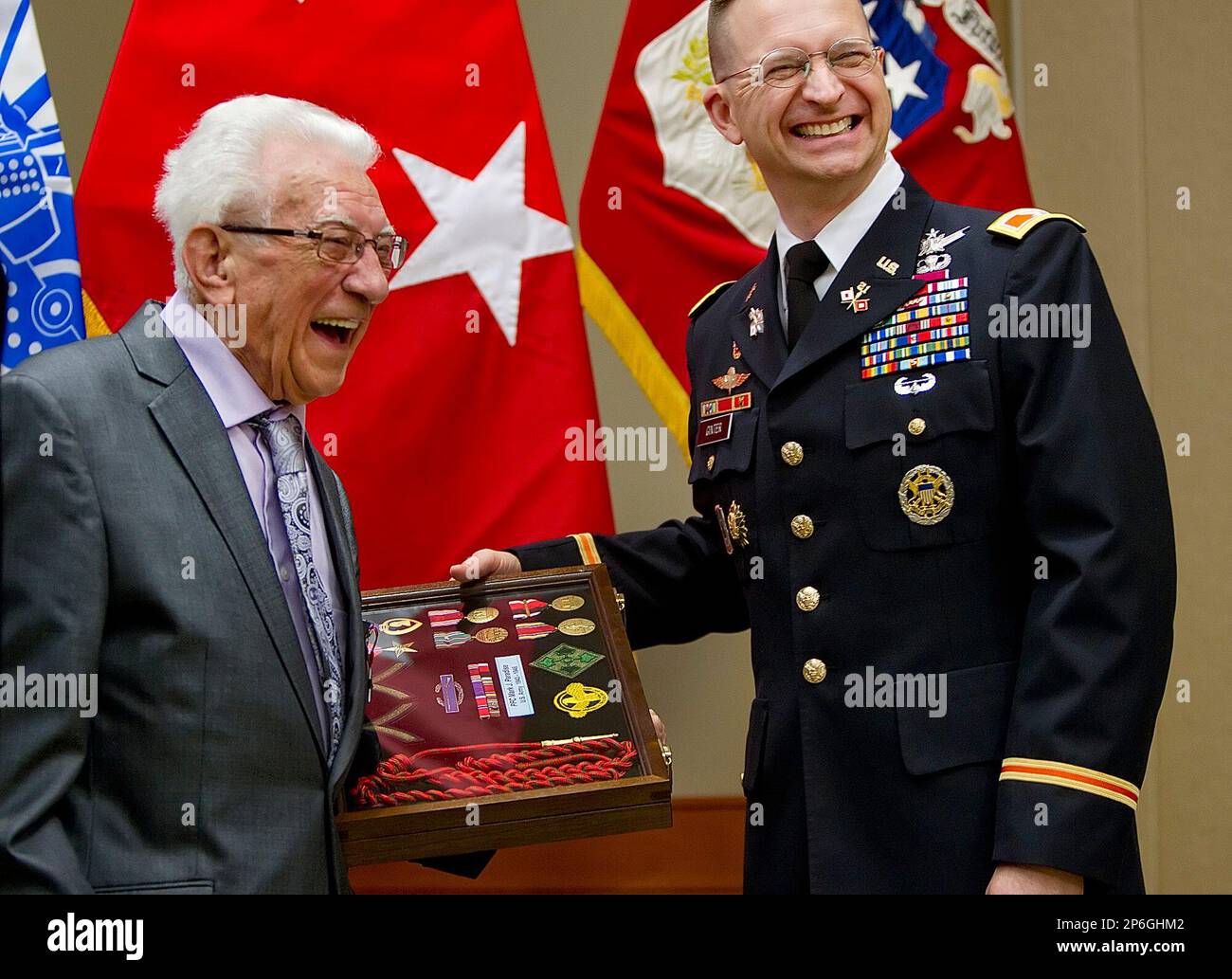 World War II combat veteran Mark Paradise, 87, shares a moment with Col ...