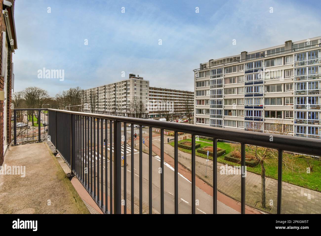 an outside area with buildings in the background and cars parked on the ...