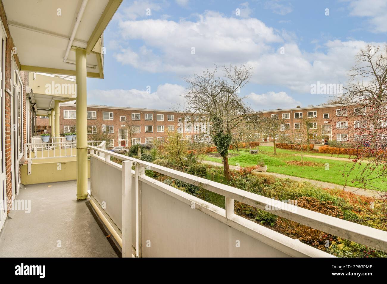 an outside area with some trees and bushes in the foreground, taken ...