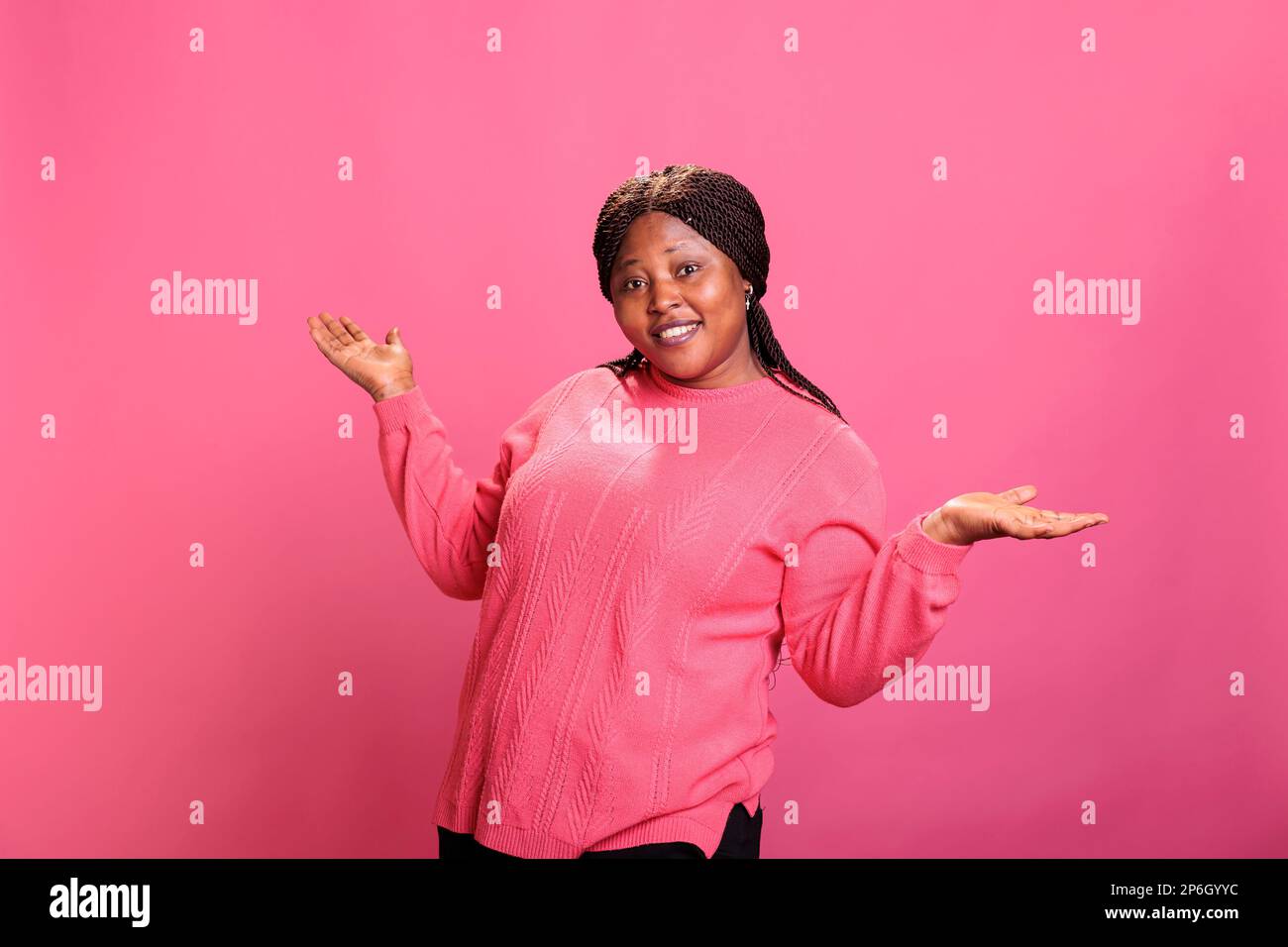 Silly funky woman expressing surprised reaction and having fun in ...