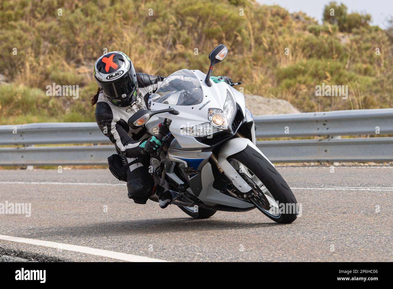 biker circulating on asphalt; photograph captured during the month of ...