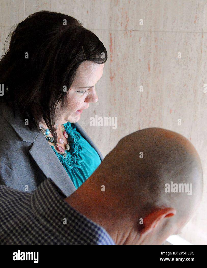 Kimberly Saenz exits court with her husband, Kevin, following closing ...