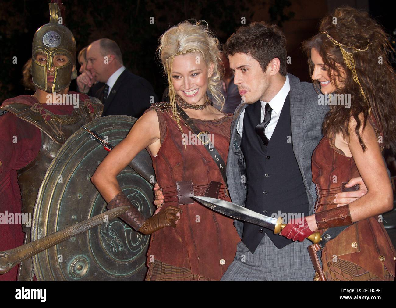 Actor Toby Kebbell poses poses with women in gladiatorial costume as he ...