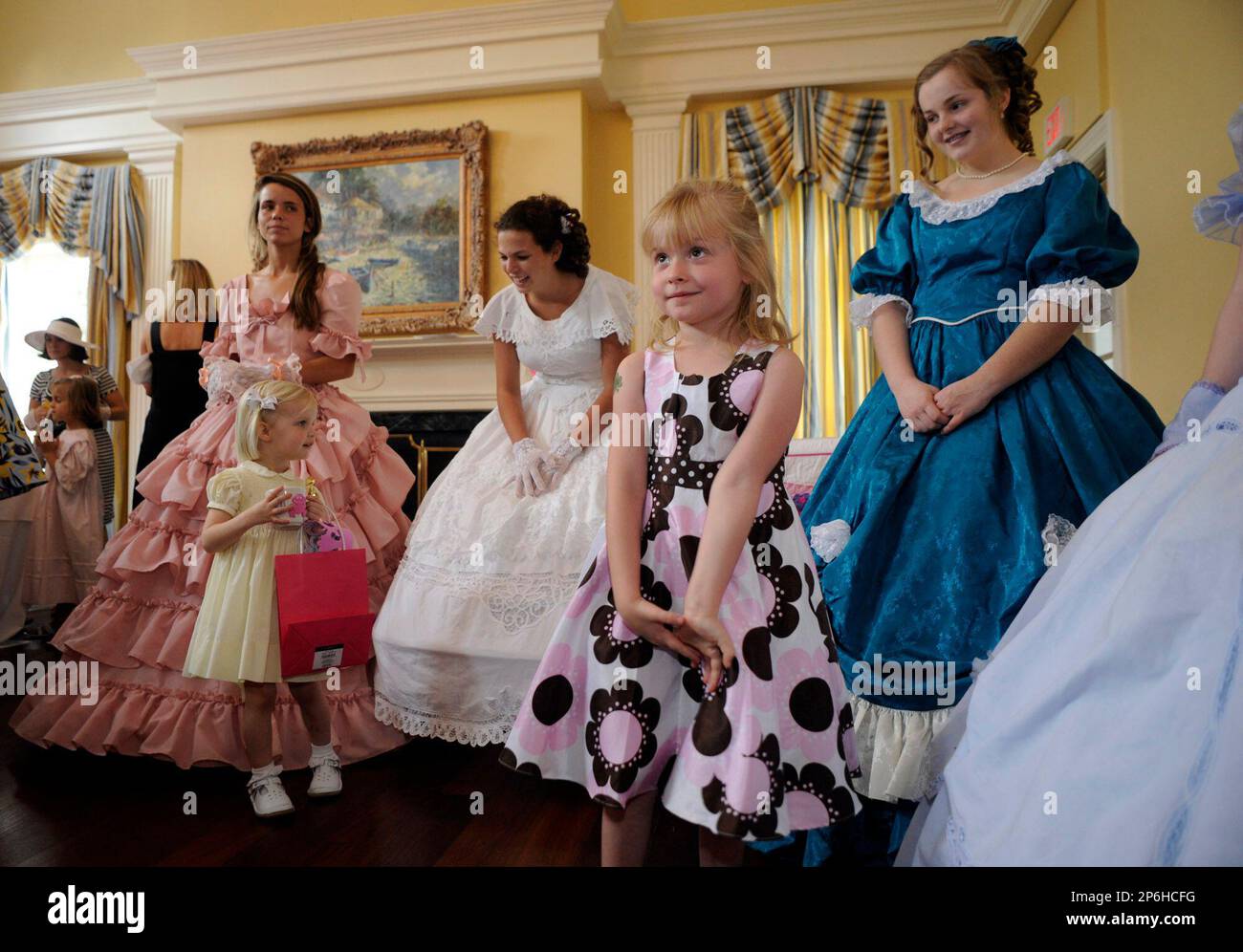 Lexie Lee, 4, stands ready for a picture with the Azalea Belles during ...