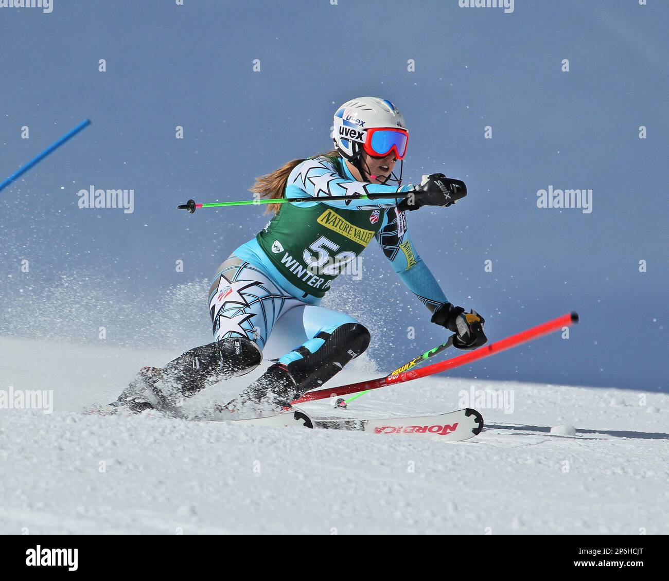 Katherine Ryan (#52) skis around a gate on the slalom course of the US ...