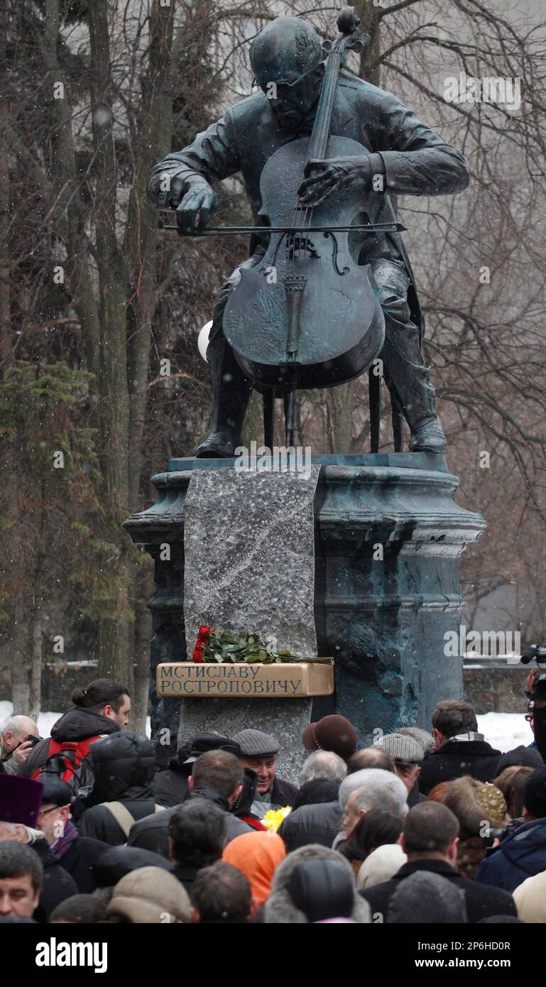People gather for a ceremony of opening of the monument to a well-known ...