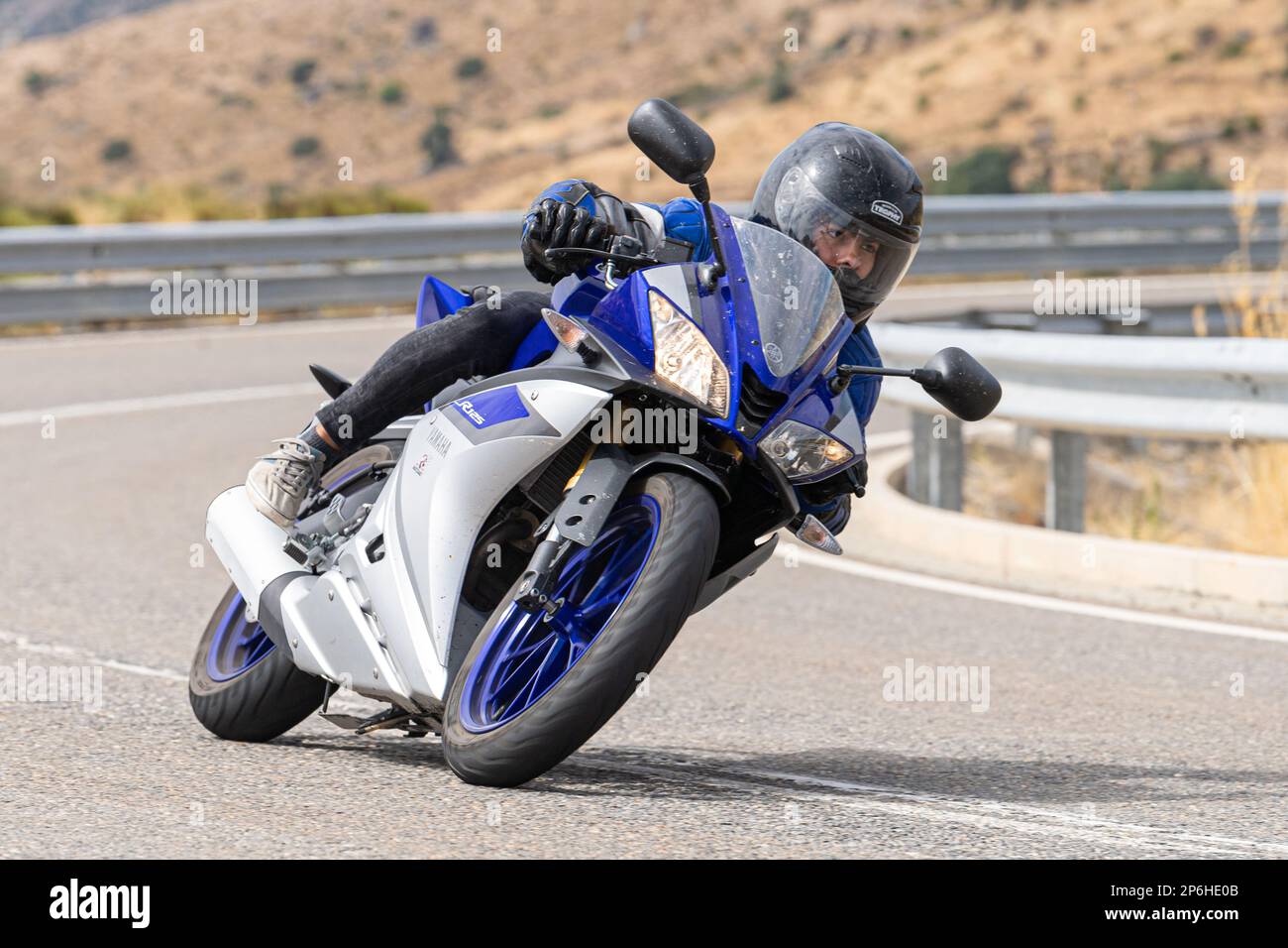 biker circulating on asphalt; photograph captured during the month of ...