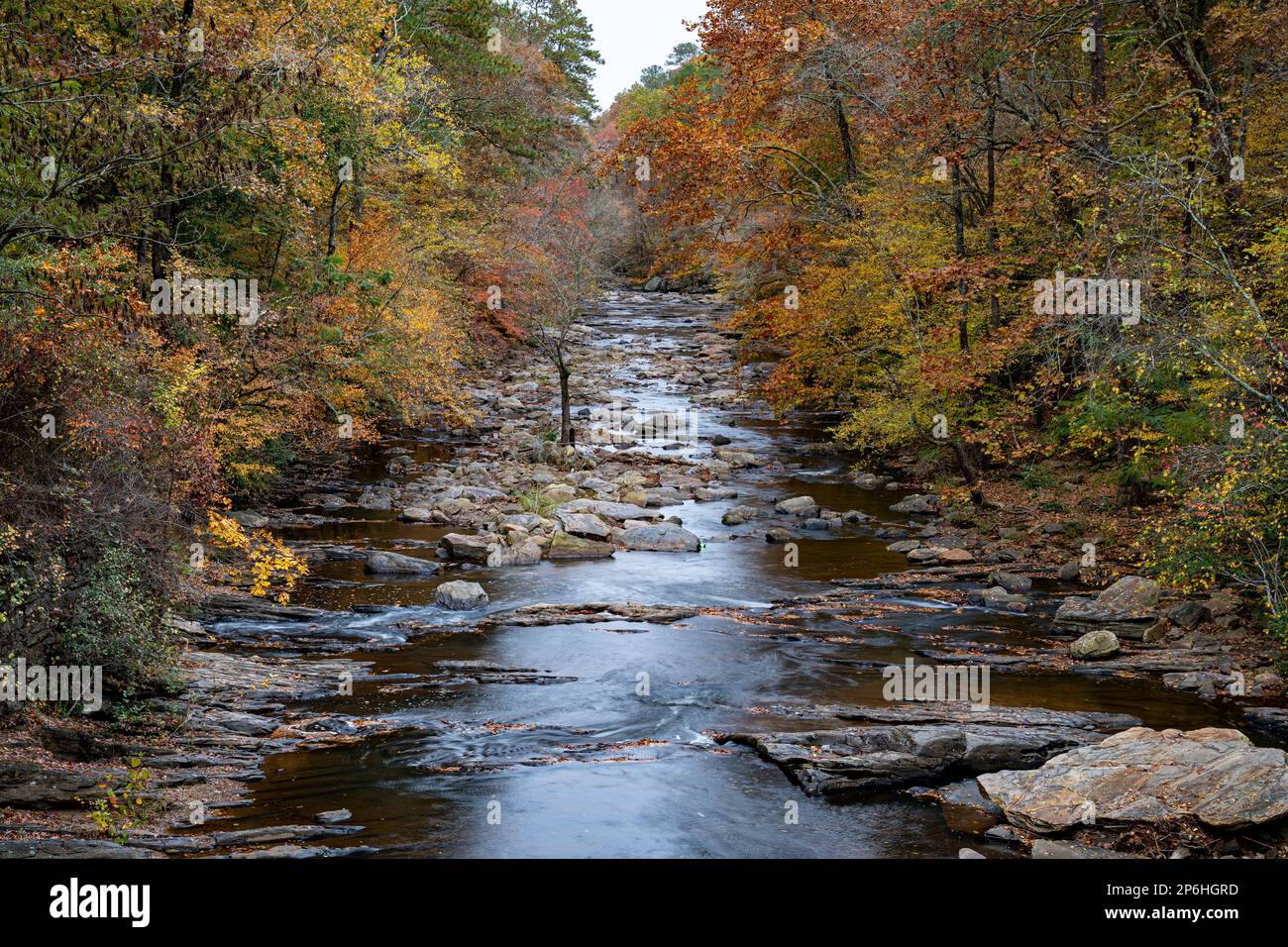 An aerial view of the Sope Creek stream winding through a mountainous ...