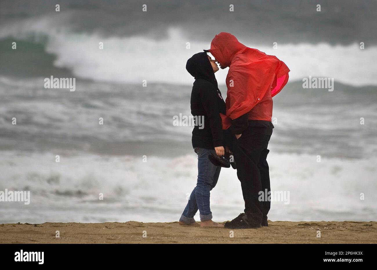 Alyssa Crank and Joe Gauthier, of Las Vegas, kiss in the rain as the ...