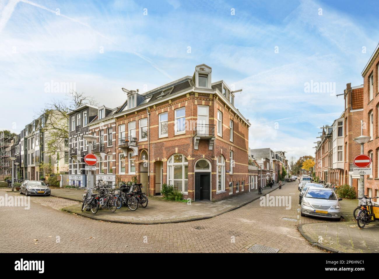 a street in the middle of an urban area with buildings and bicycles ...