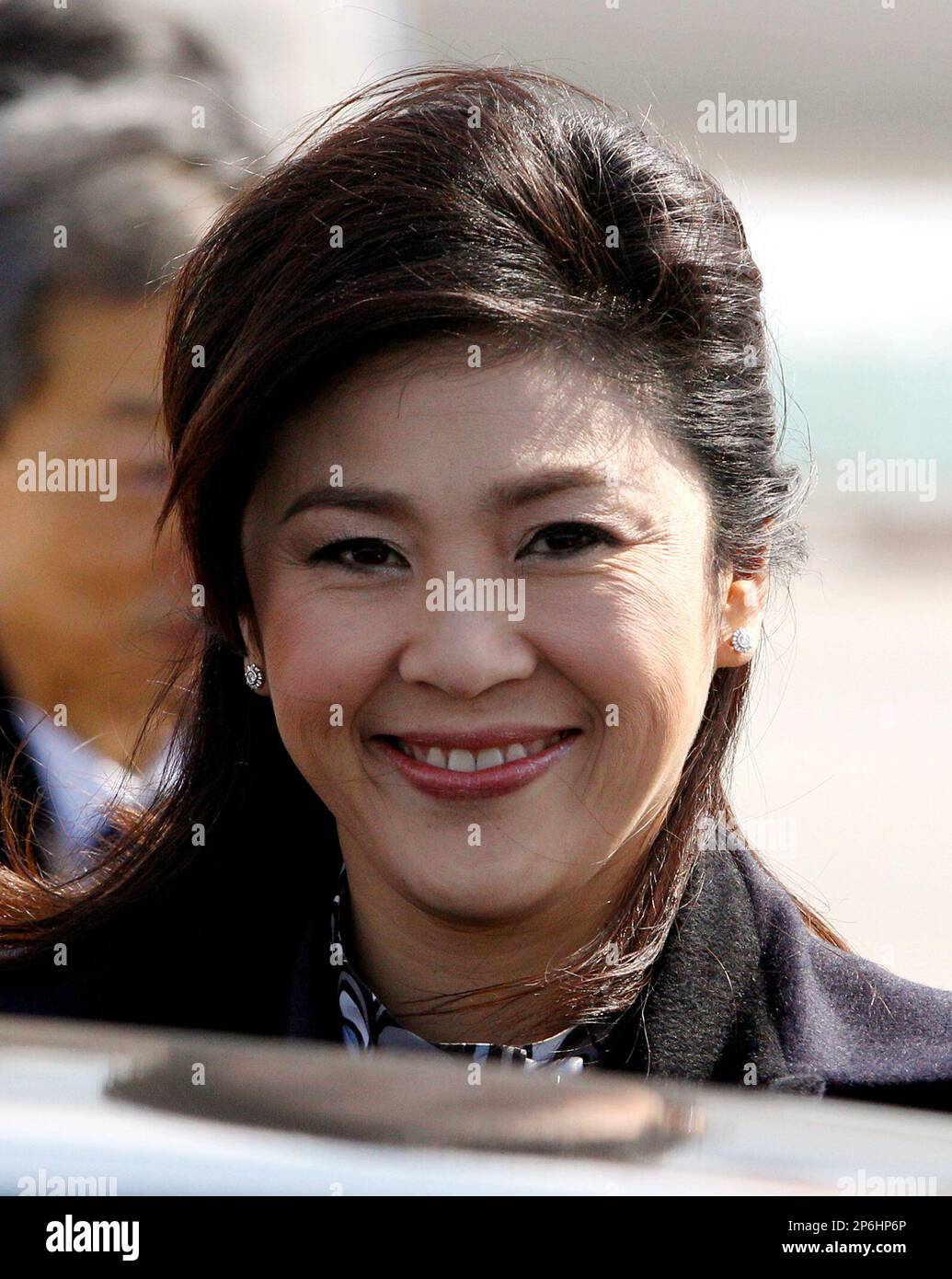 Thai Prime Minister Yingluck Shinawatra smiles on her arrival at the ...