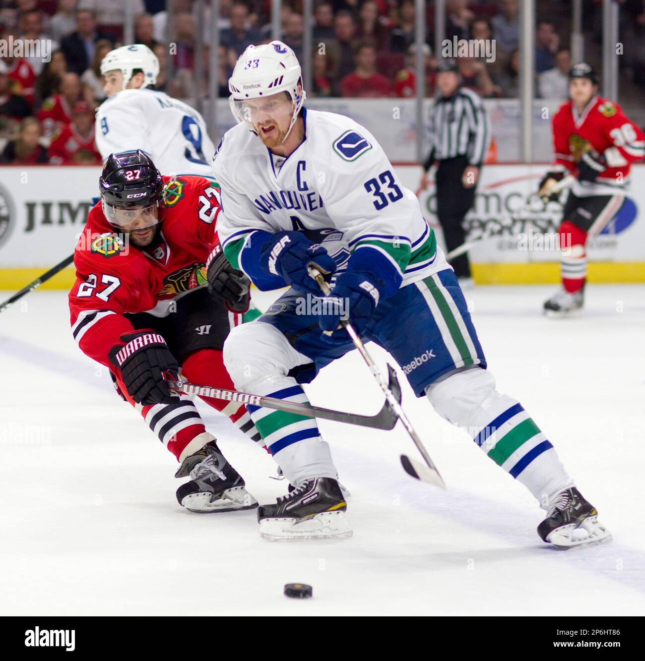 March 21, 2012: Chicago, IL. Blackhawk Johnny Oduya #27 and Canuck ...