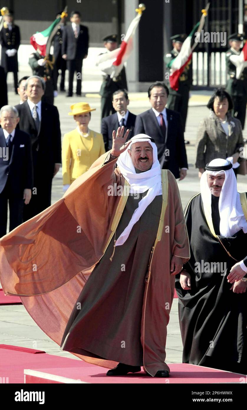 Kuwaiti ruler Sheikh Sabah al-Ahmad al-Sabah (C) waves his hand during ...