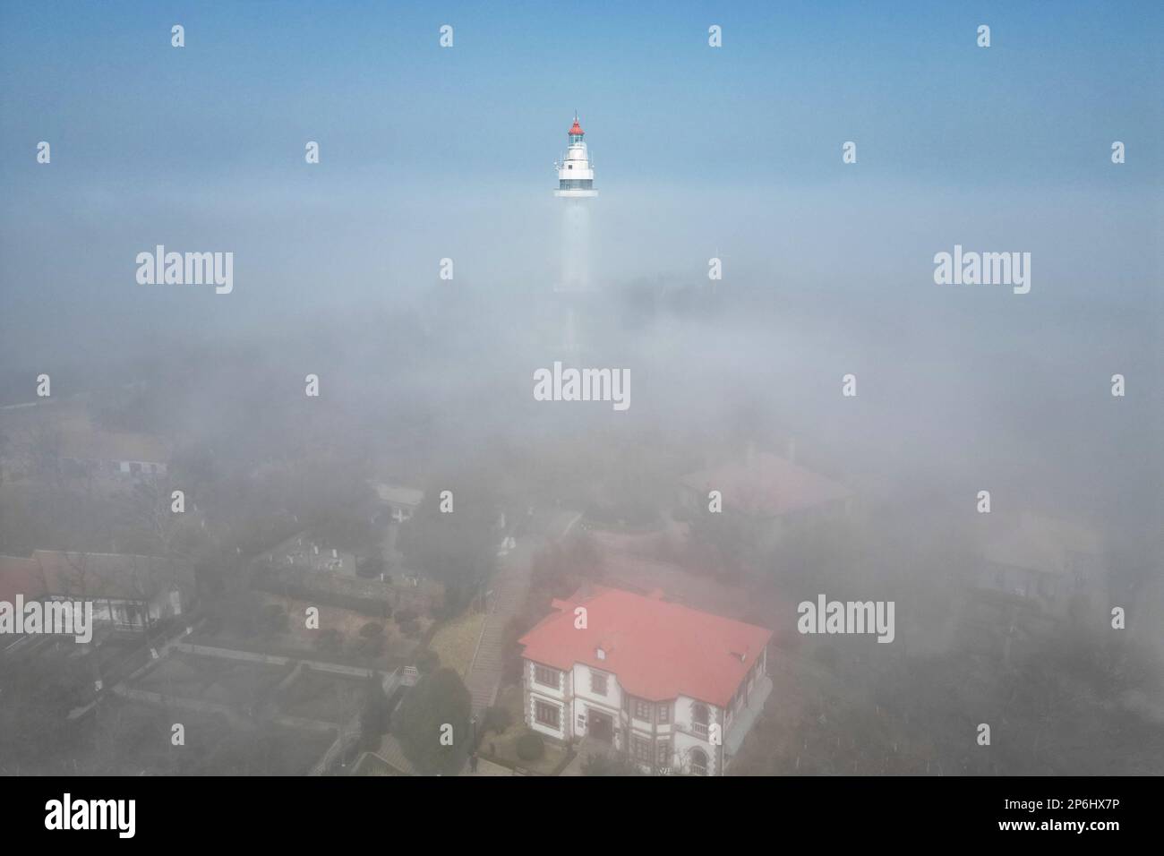 YANTAI, CHINA - MARCH 7, 2023 - Advection fog surrounds high-rise ...