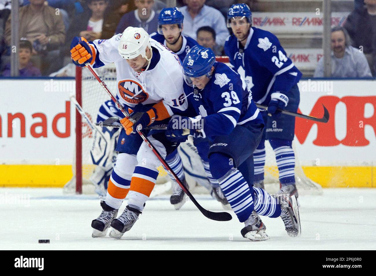 Toronto Maple Leafs' Matt Fratin (39) battles for the puck with New ...