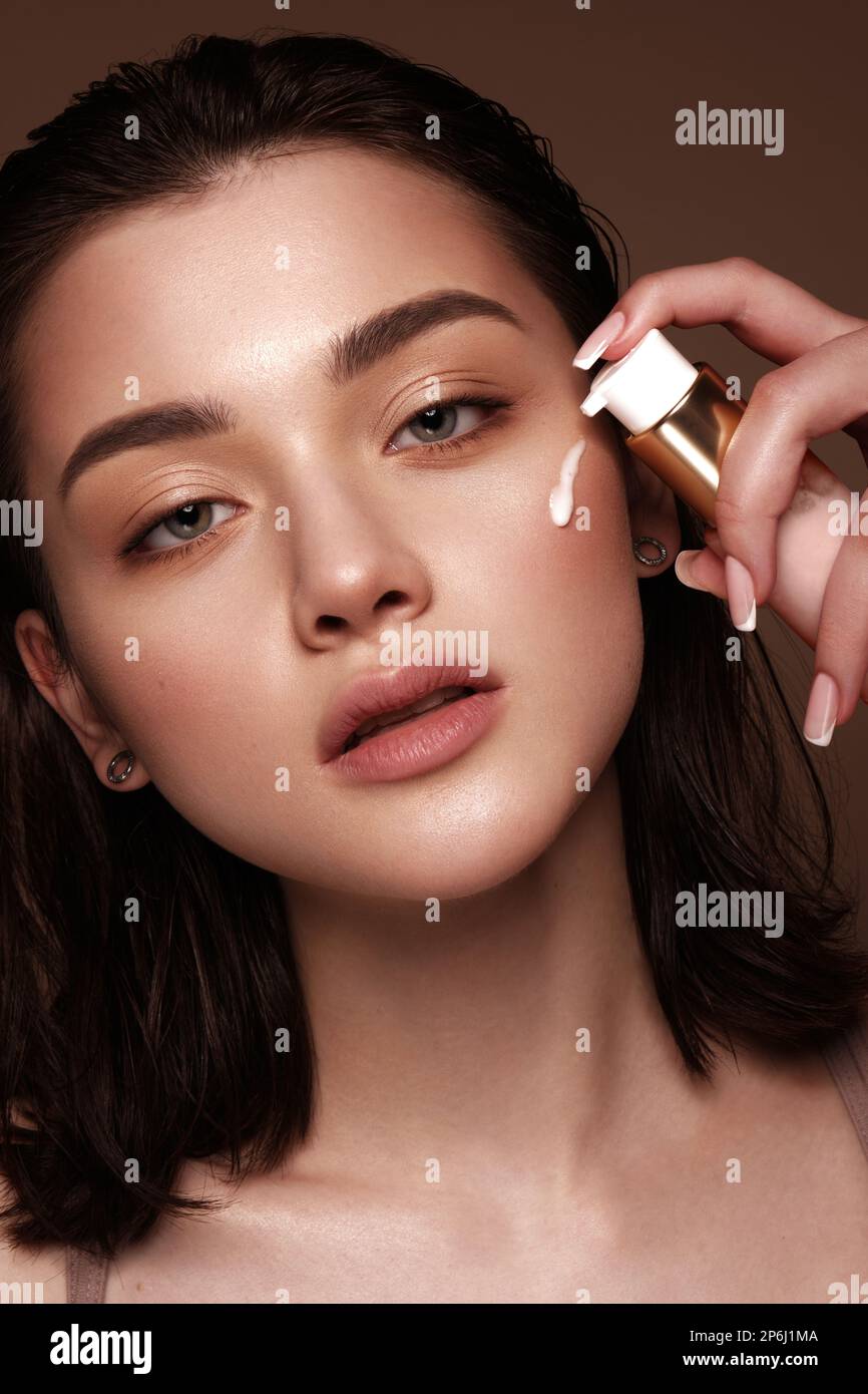 Beautiful Young Girl With Natural Nude Make Up With Cosmetics Cream In 6794