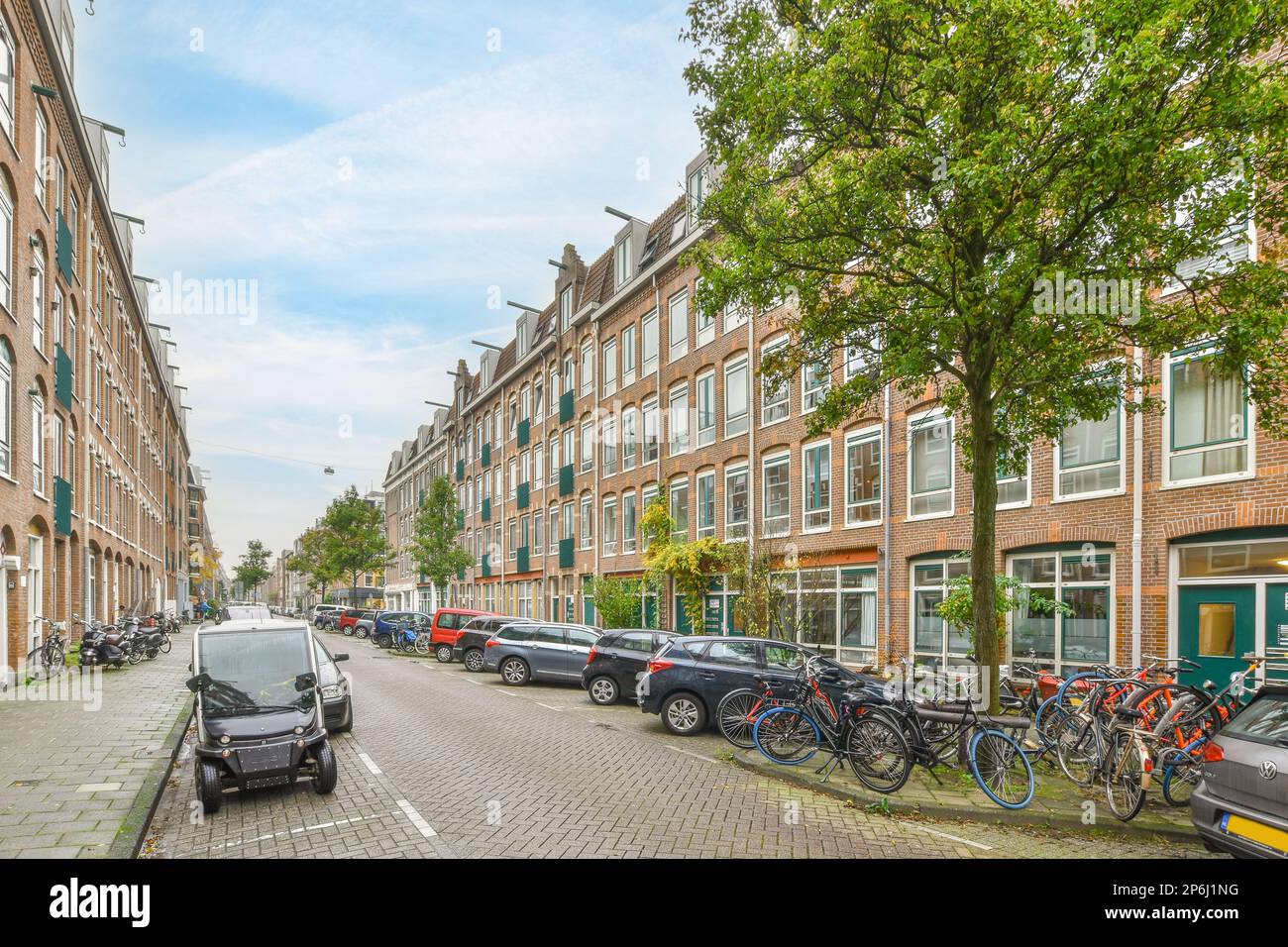 Amsterdam, Netherlands - 10 April, 2021: some cars parked on the side ...