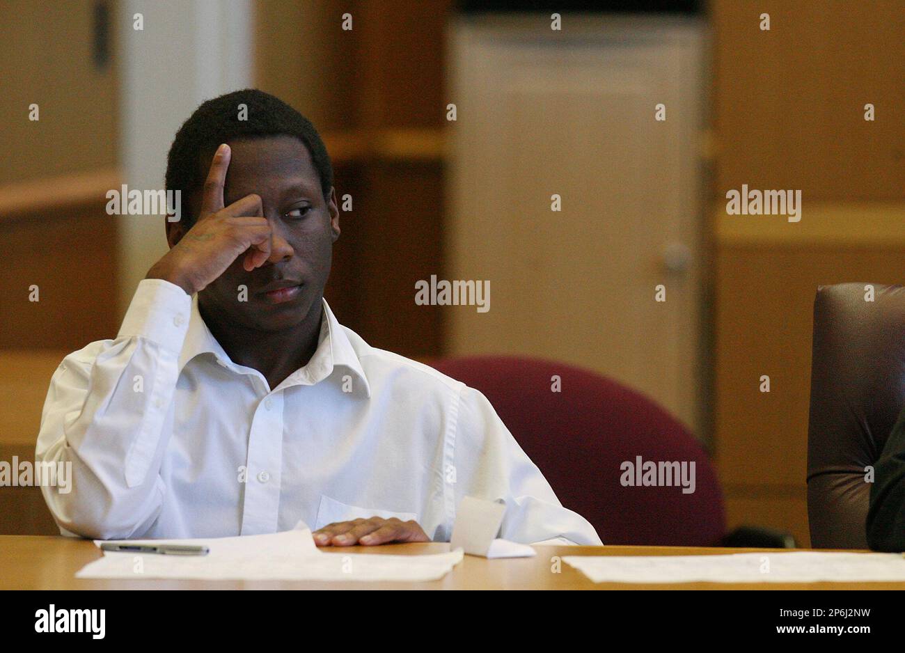 Defendant Nicholas Lindsey listens as potential jurors are questioned ...