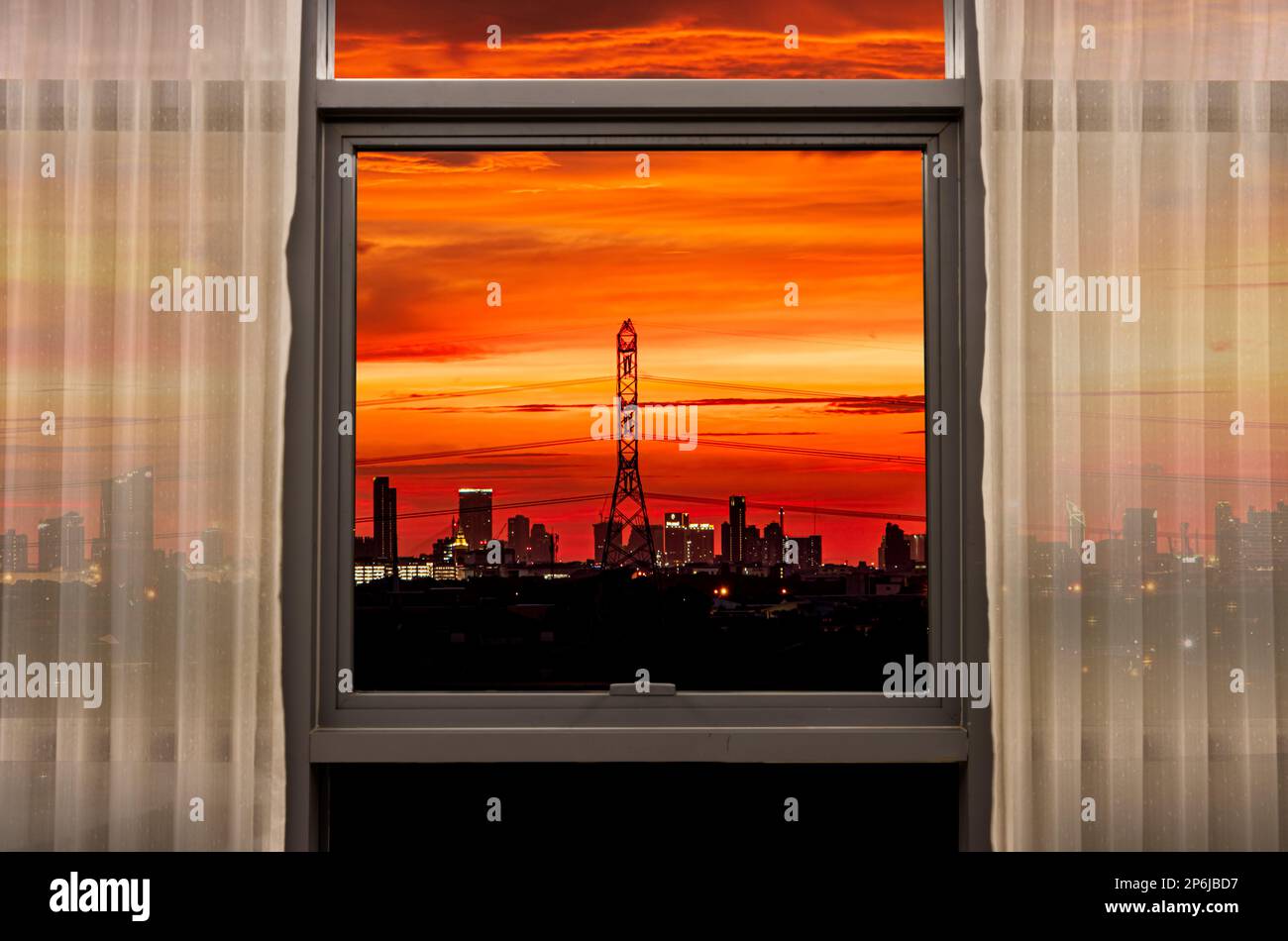 View from the window of the city skyline at sunset Stock Photo - Alamy