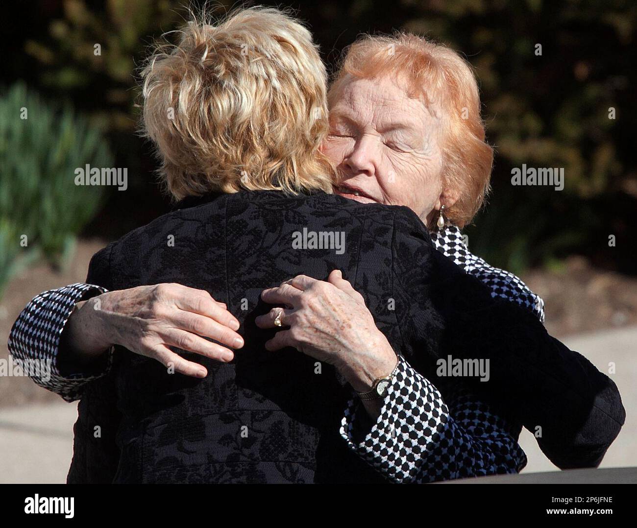 Rosemarie Colvin, right, mother of Marie Colvin, is embraced by a ...