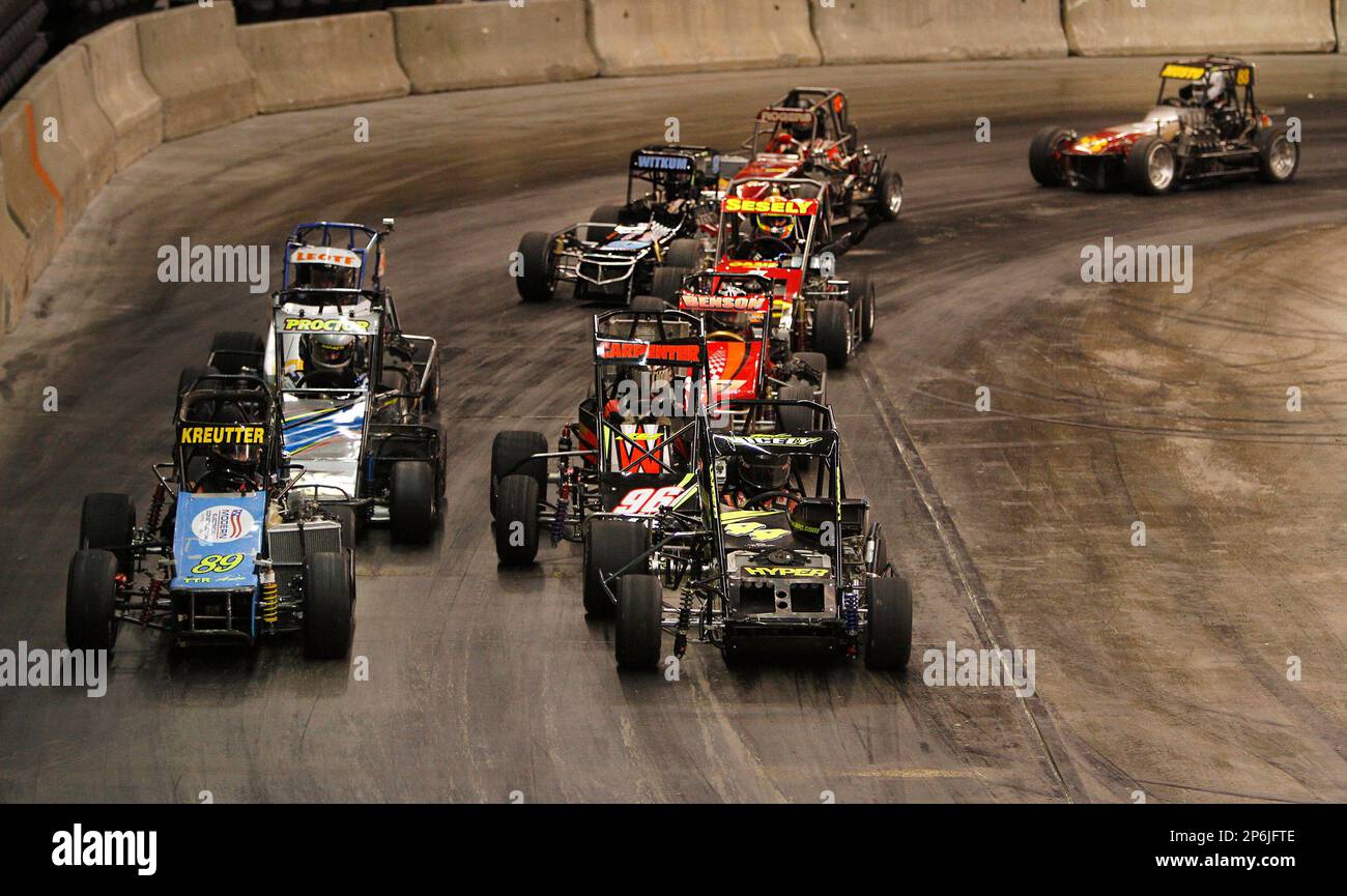 TQ midget race cars compete in a preliminary heat during the 2012 ...