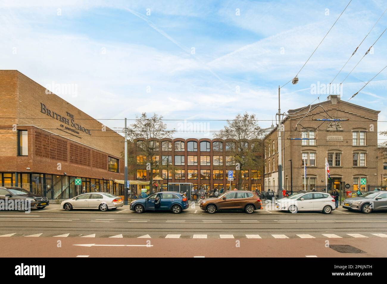 Amsterdam, Netherlands - 10 April, 2021: a city street with cars parked ...