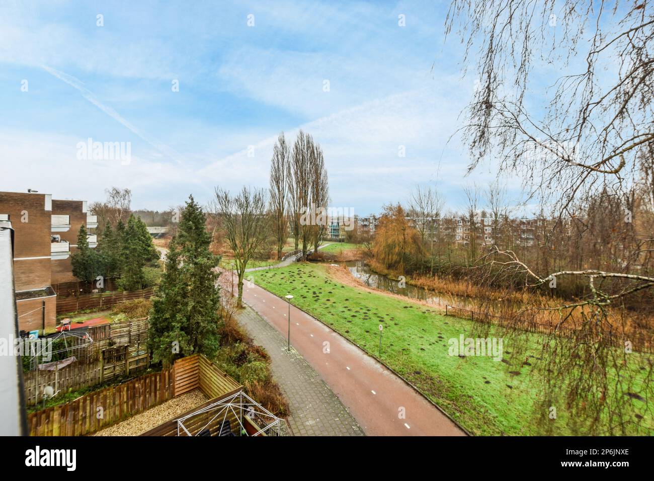 an outside area with trees and houses in the distance, taken from a ...