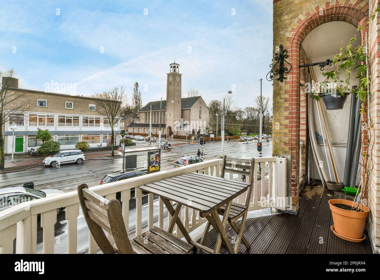 an outside area with wooden chairs and tables on the front porch ...